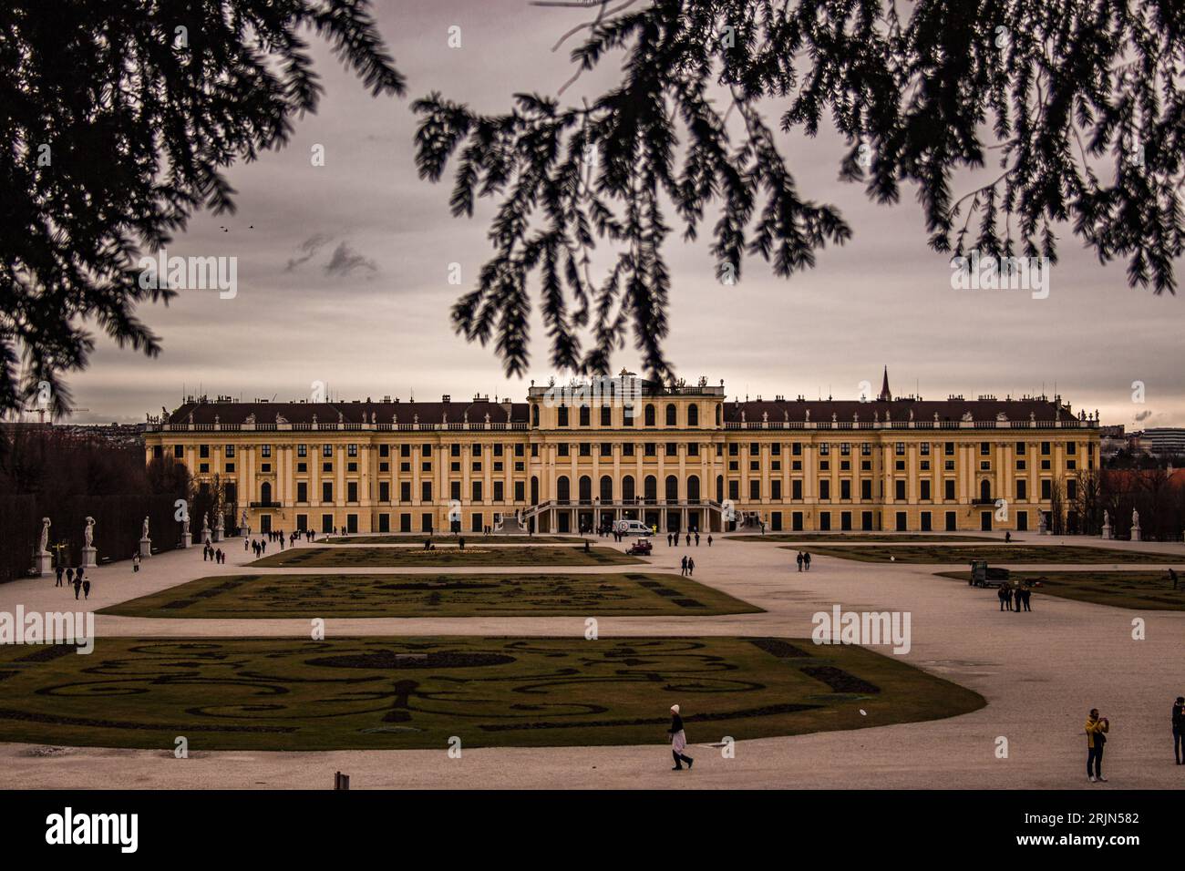 An aged building located in an area surrounded by trees, with a lush ...