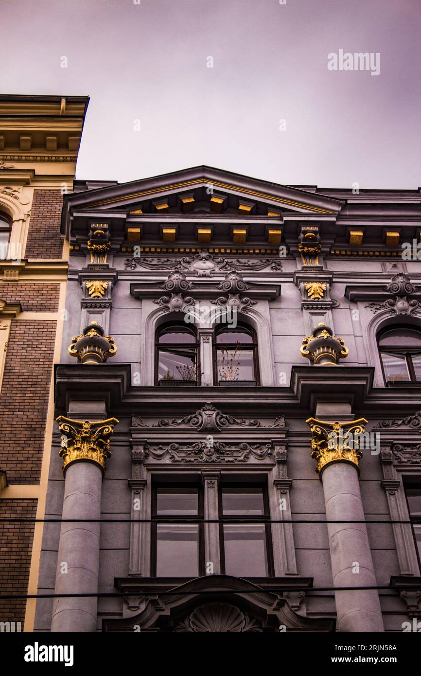 A modern skyscraper structure with rectangular windows situated along a ...