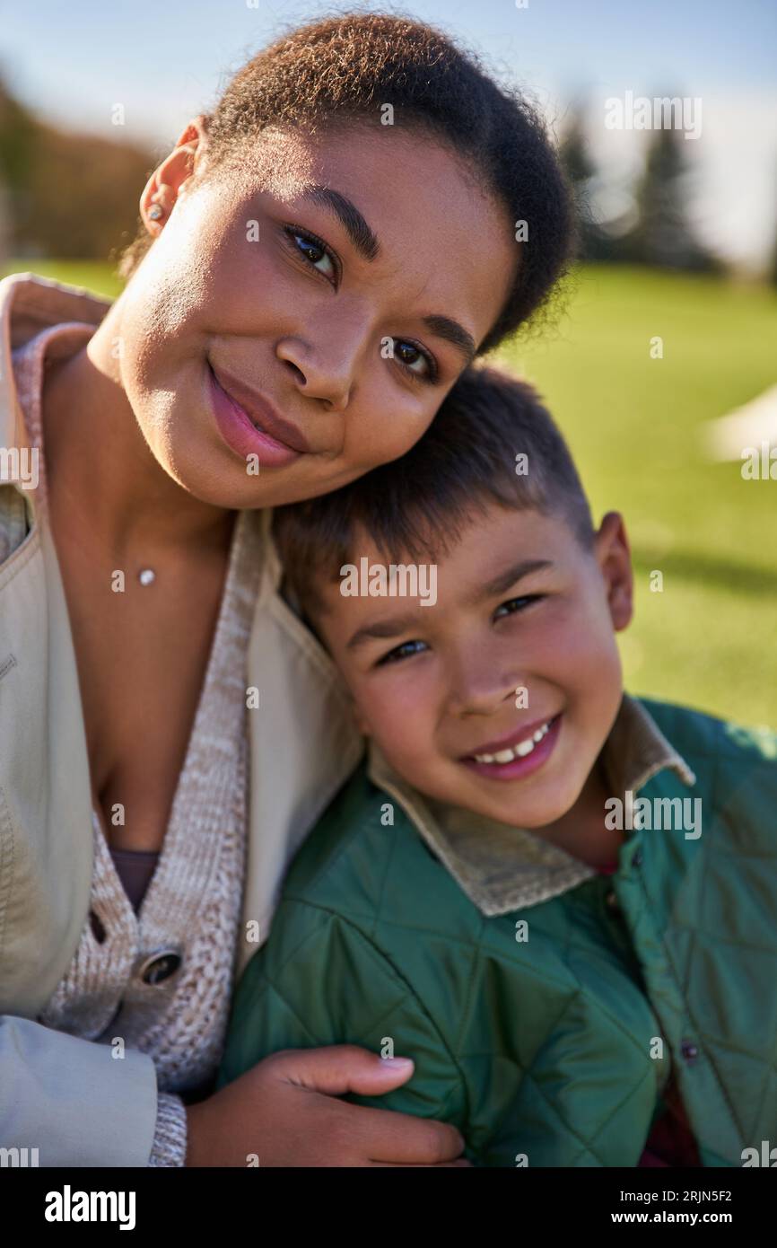 portrait of happy african american woman and boy, mother and son hugging, love and bonding Stock ...
