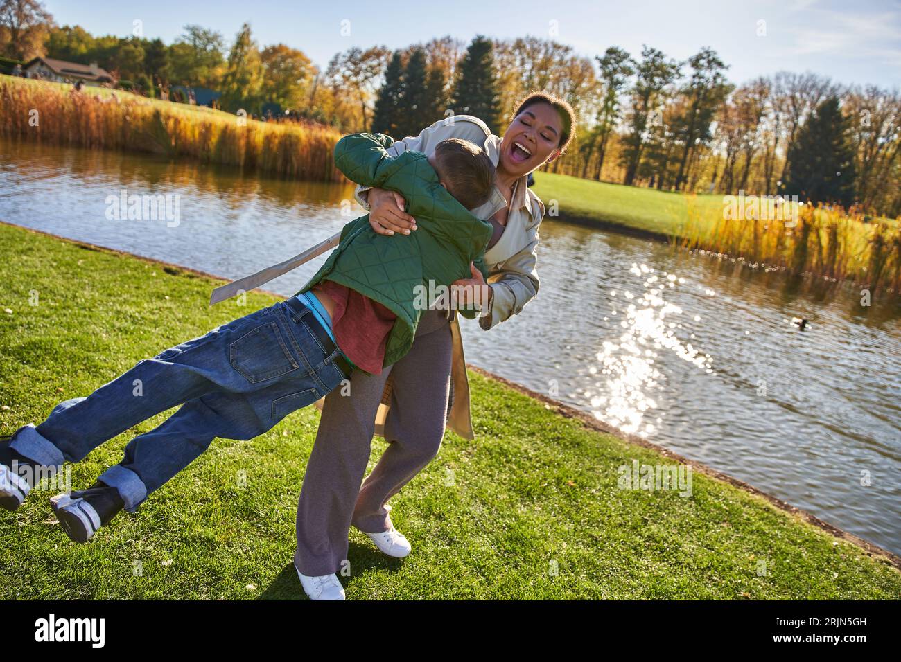 playful, joy, happy african american mother lifting son, having fun ...
