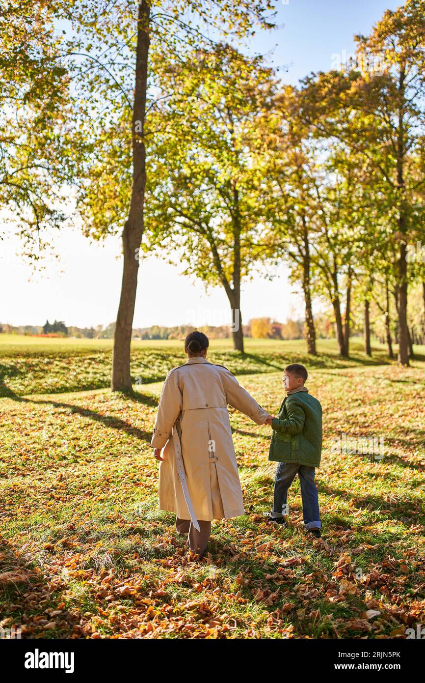 happy memories, mother and son walking in park, autumn leaves, fall ...