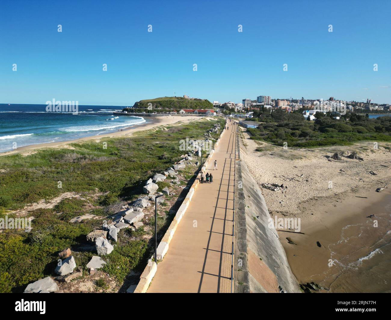 A scenic view of a long, winding road running parallel to an expansive ...