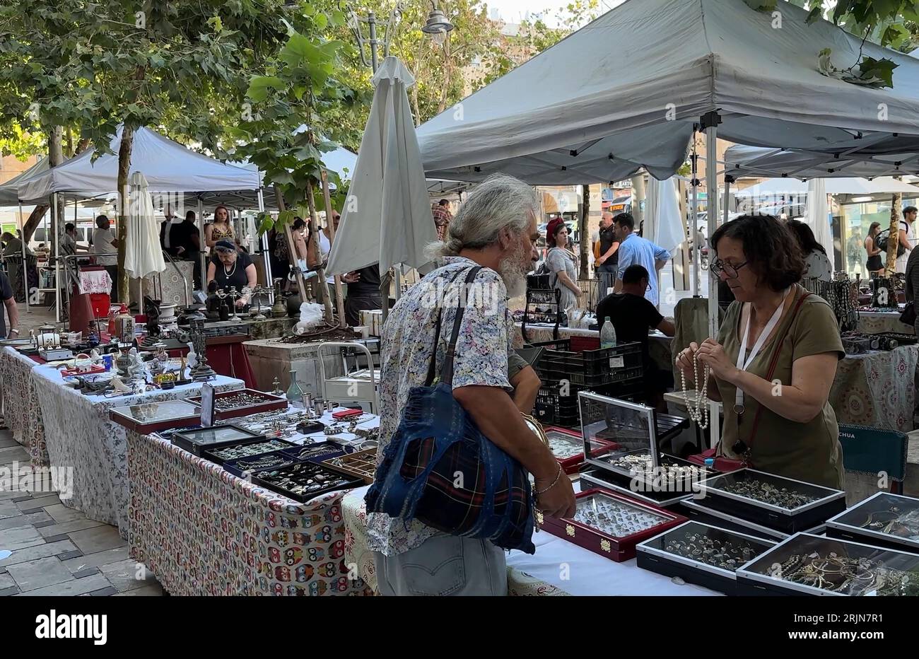 Vendors sell second-hand items and vintage wares at the flea market in ...