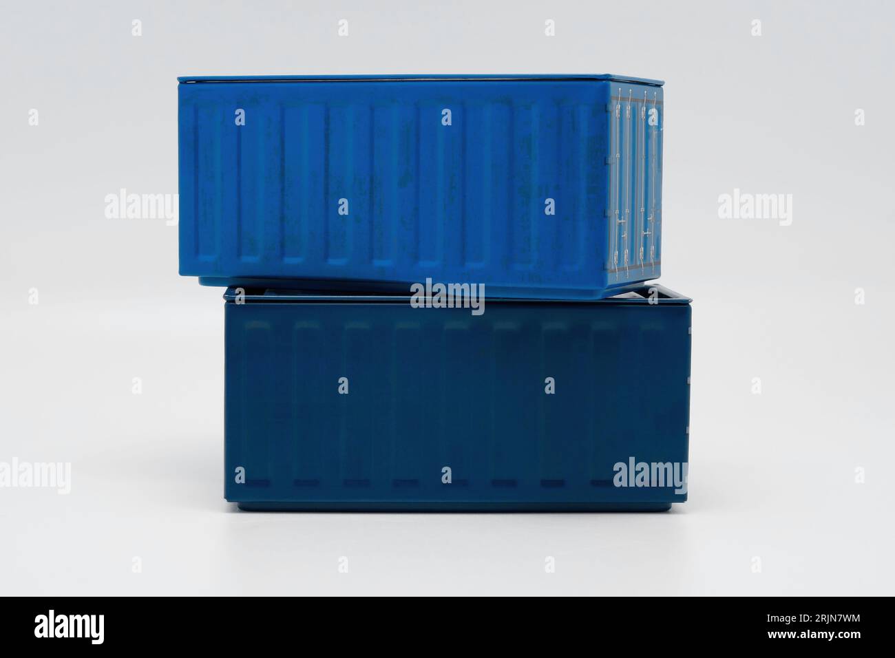 A stack of blue shipping containers against a white background Stock ...