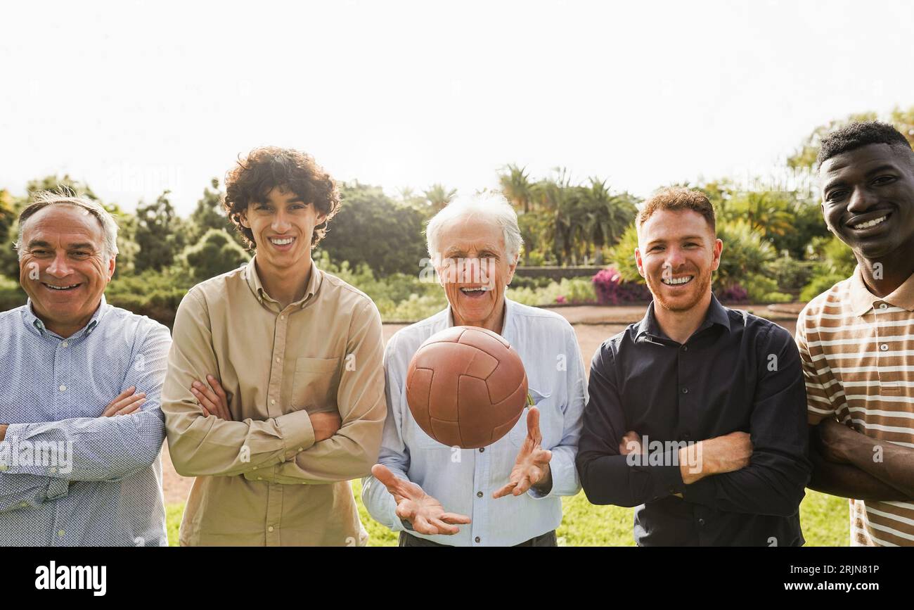 Multi generational men smiling in front of camera - Male multiracial ...