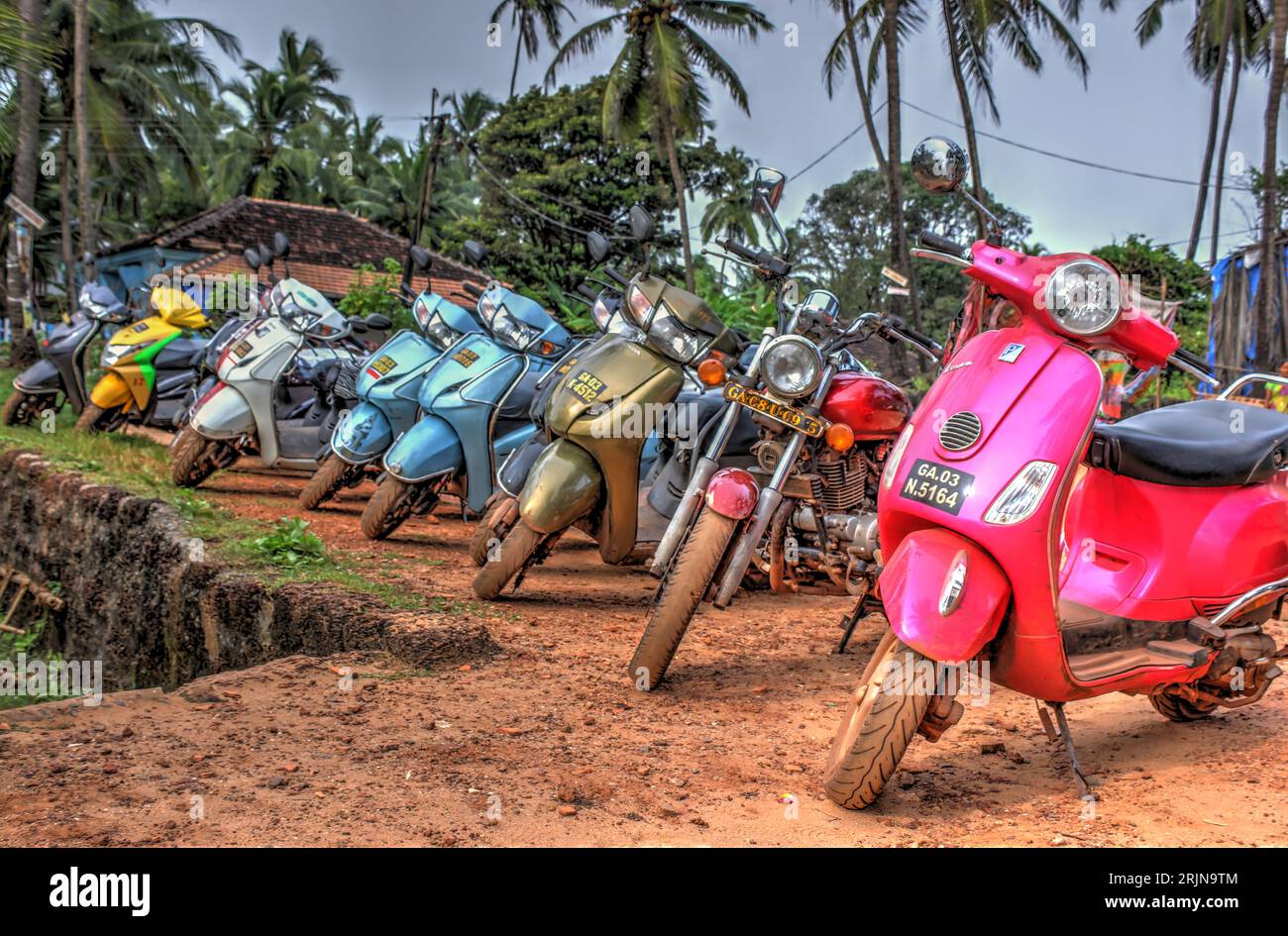 A line of colorful motorbikes in Goa, India Stock Photo - Alamy