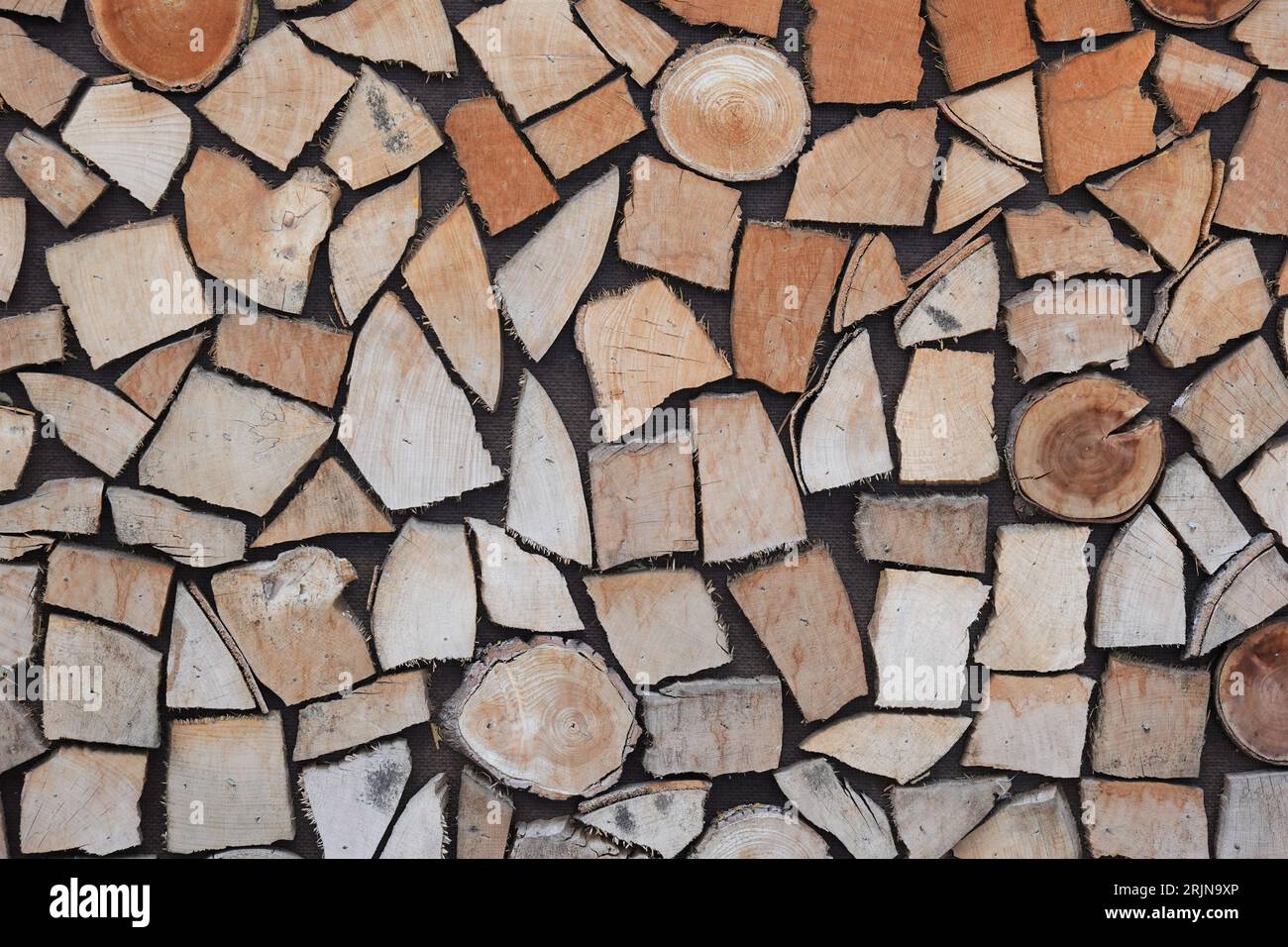 A beautiful pile of wood logs, neatly arranged to create a rustic and ...