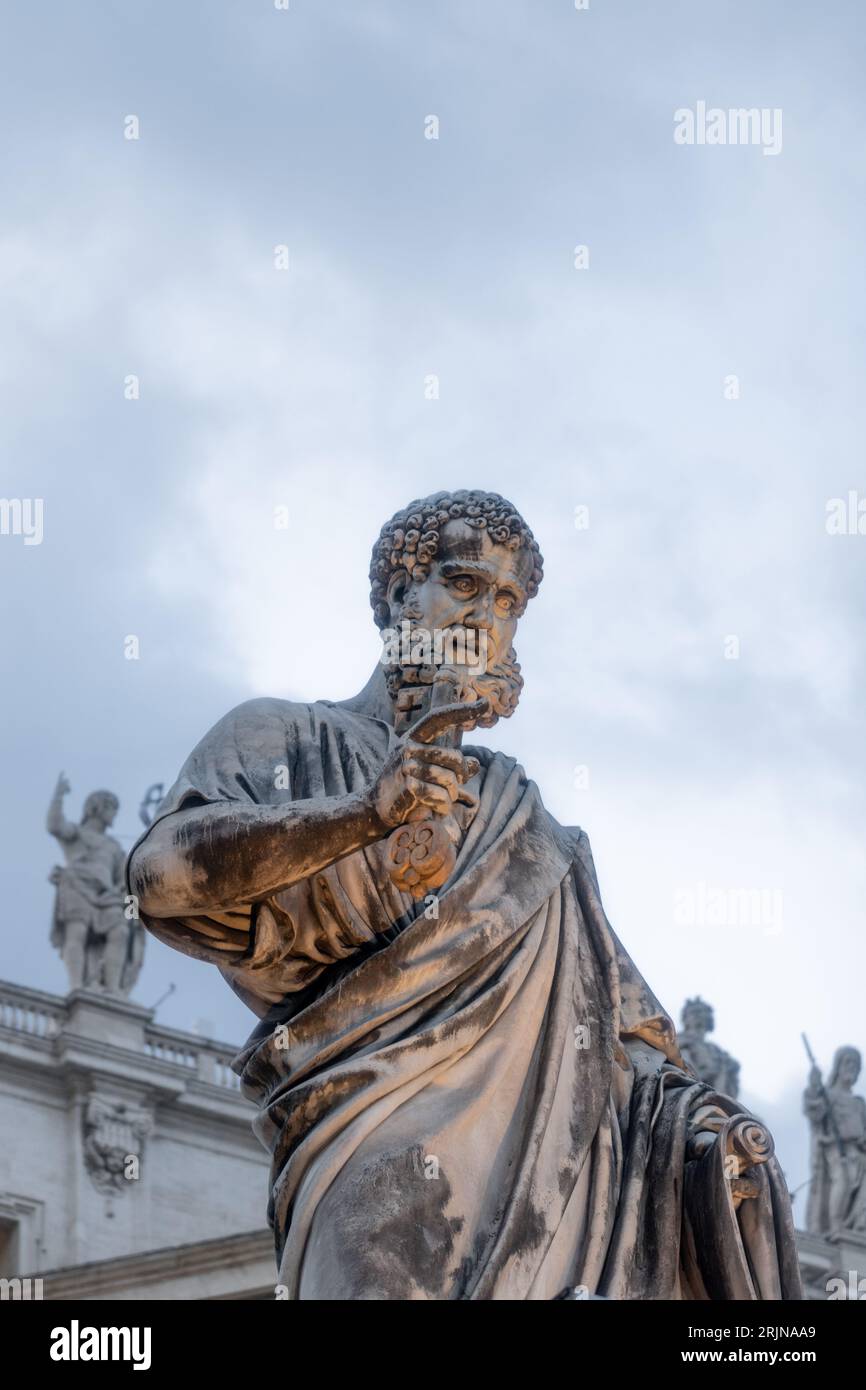 The St Peter's Basilica in Vatican City, Rome, Italy, with a statue ...