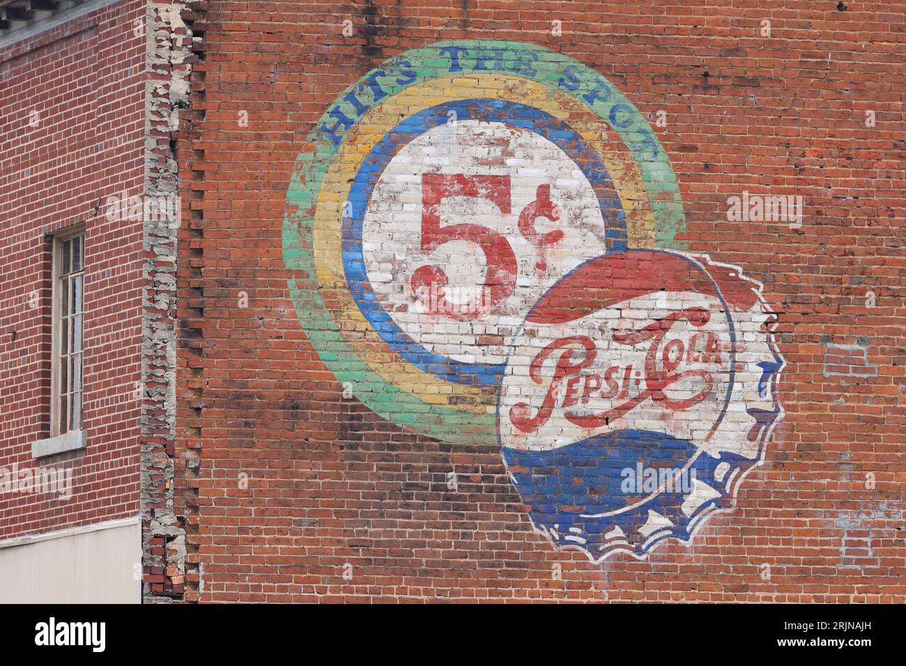 A closeup of old Pepsi Cola signage on side of brick building, Elkin ...