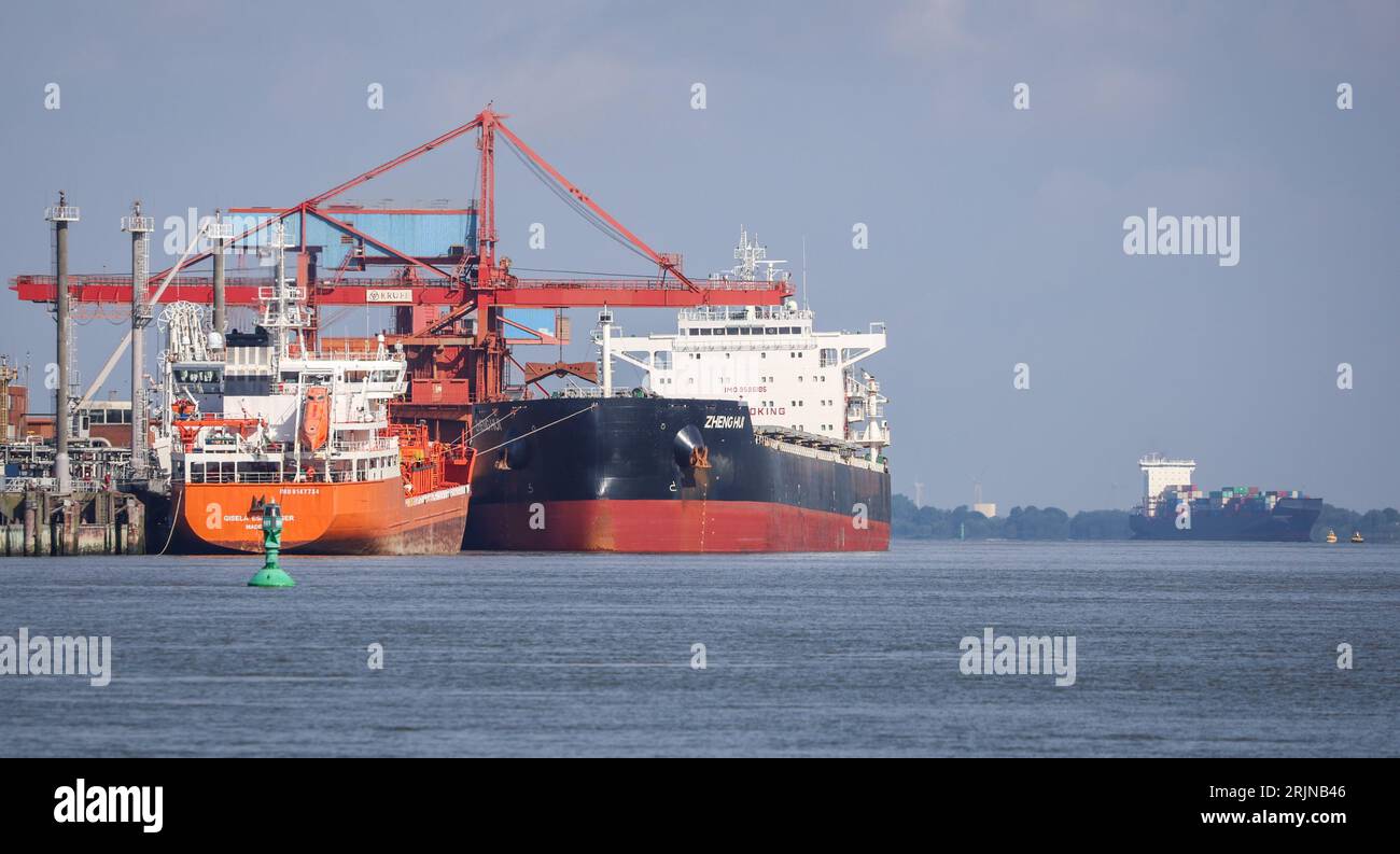 23 August 2023, Lower Saxony, Stade: Two ships are moored at the ...
