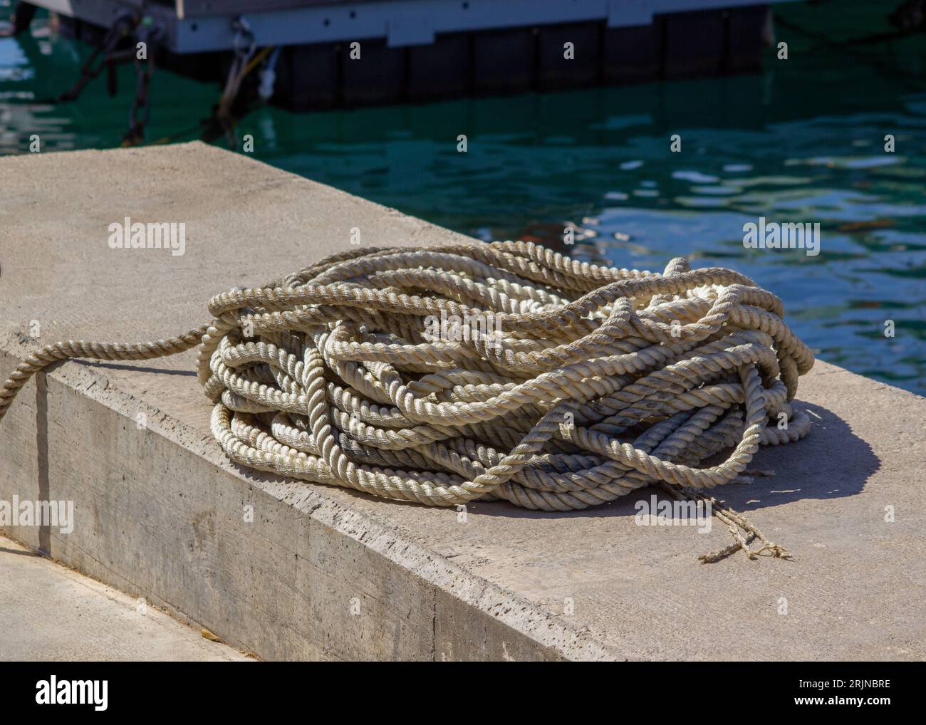 Coiled rope on dock hi-res stock photography and images - Alamy
