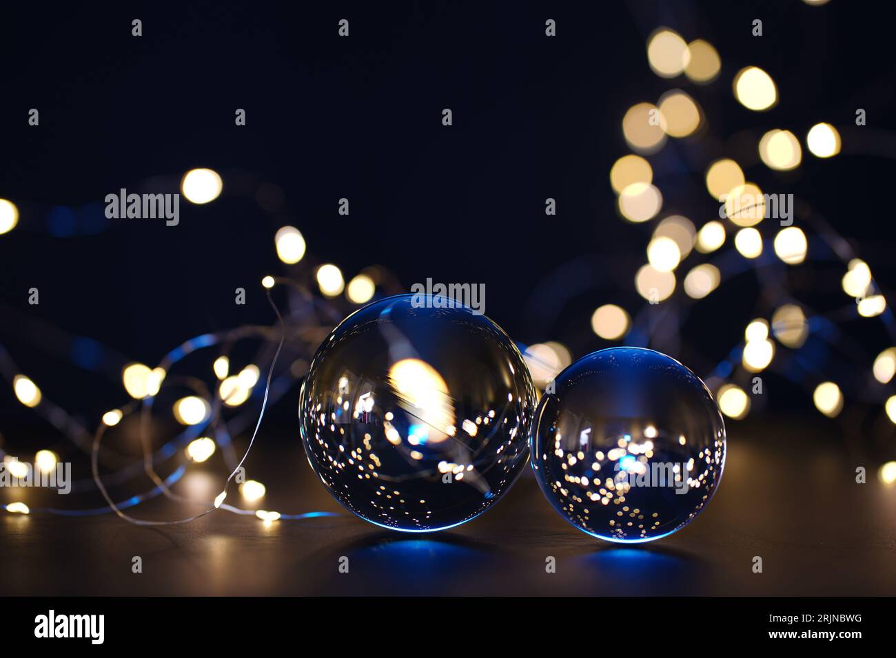 A lens ball with a clear and blue light shining through it, creating a ...