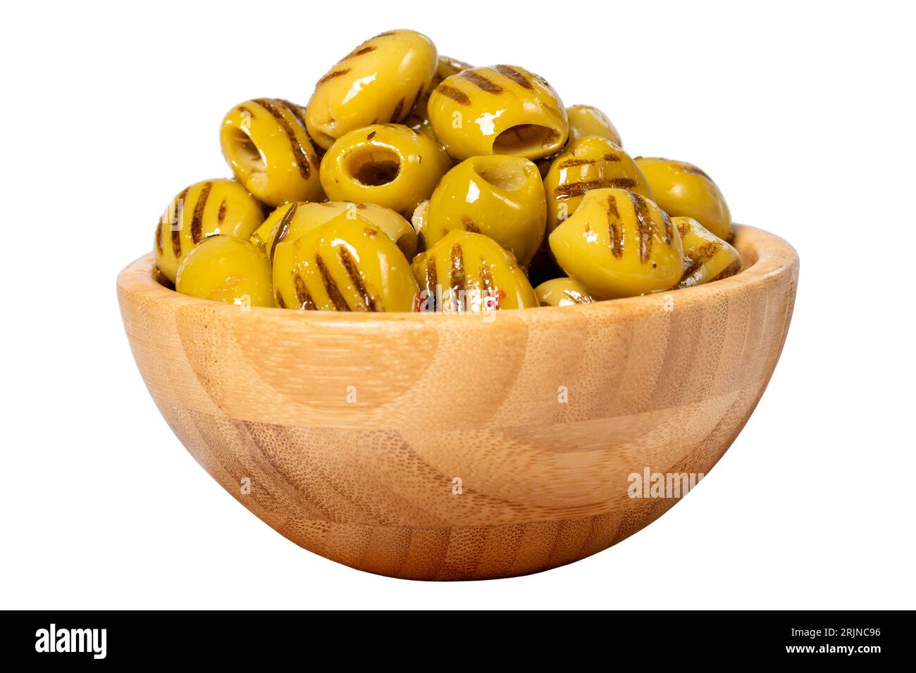Grilled olives at wooden bowl. Grilled green olives isolated on white ...
