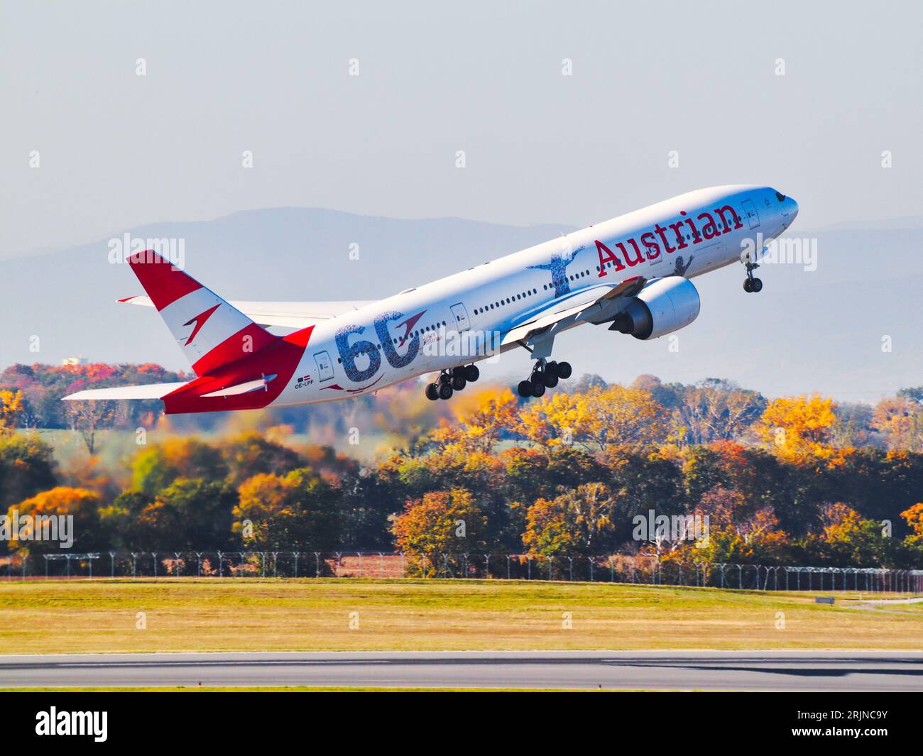 The Austrian Airlines B777 taking off at golden hour Stock Photo - Alamy