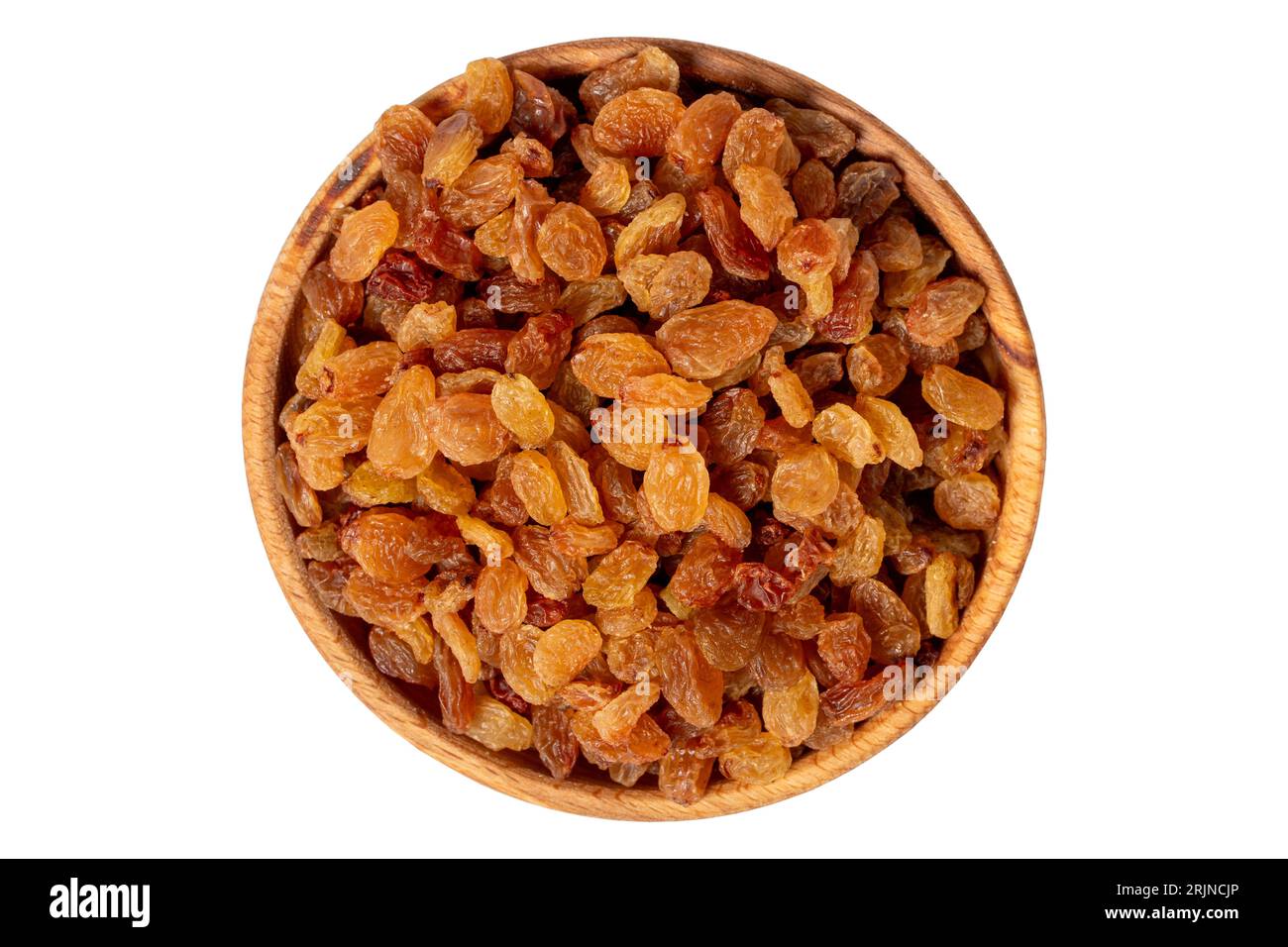 Raisins in wooden bowl. Sun-dried natural raisins isolated on white ...