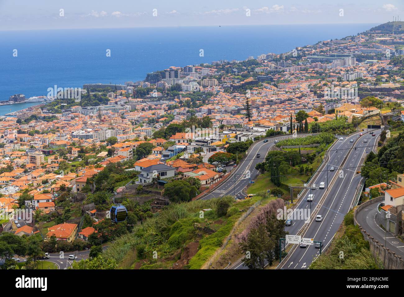 An aerial view of a cityscape, featuring its bay and residential area ...