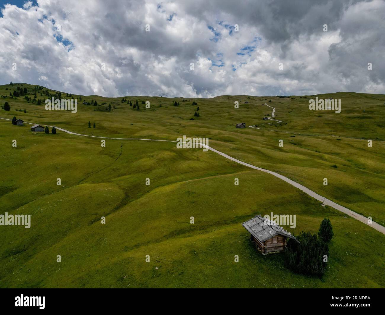 Wooden hut on An Aerial view of Armentarola fields Dolomites Alps near ...