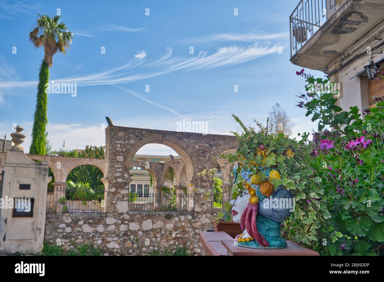 typical head of the moors as a flower vase and old stone walls in the ...