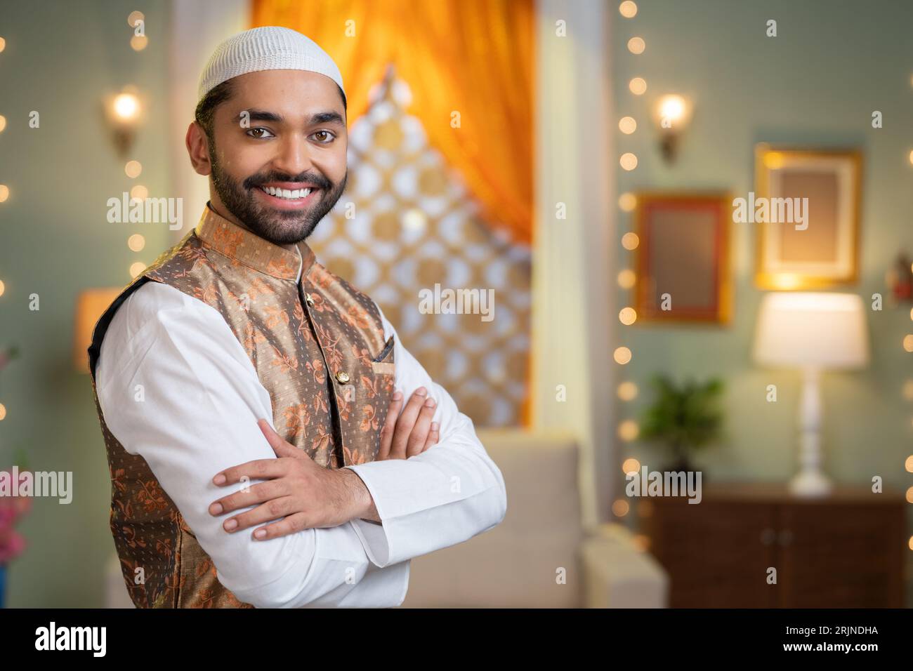 Happy smiling indian muslim man in traditional ethnic wear with crossed ...