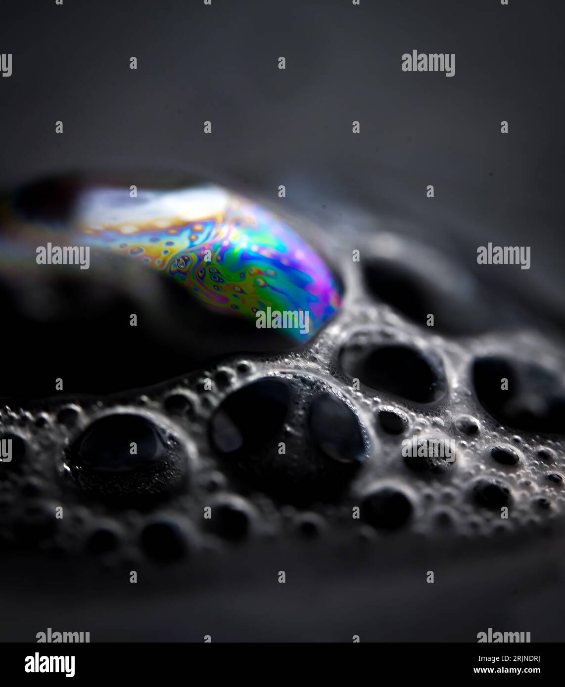 Oily Bubbles Reflecting From Light Source Stock Photo - Alamy