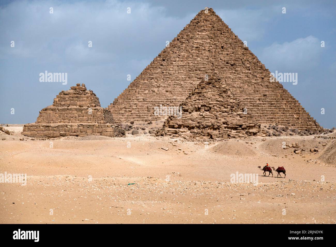 A man on a camel in Egypt Cairo Desert near Pyramids of Giza Stock ...