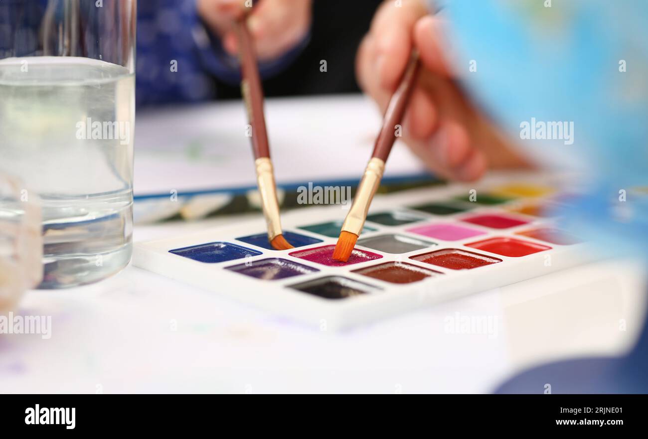 Brush point in watercolor paint closeup Stock Photo - Alamy