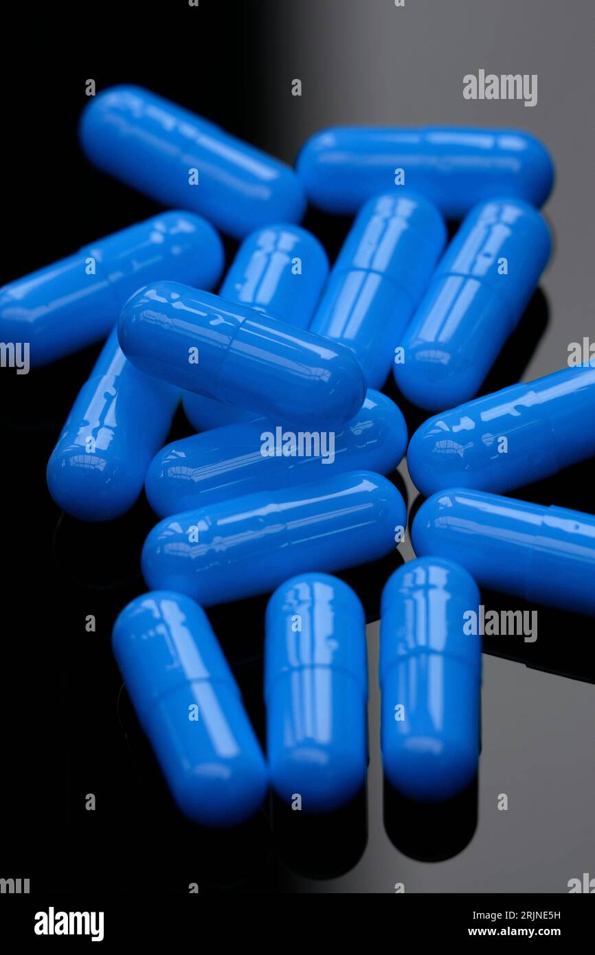 Blue Medical capsules Stock Photo - Alamy