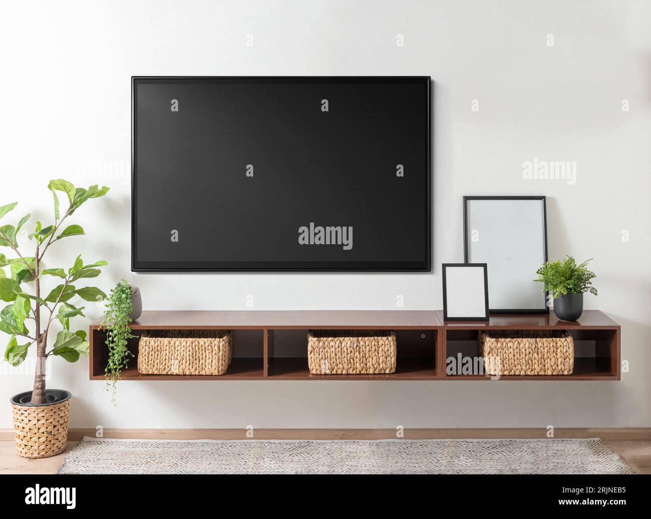 A contemporary living space featuring a television mounted to a wall ...
