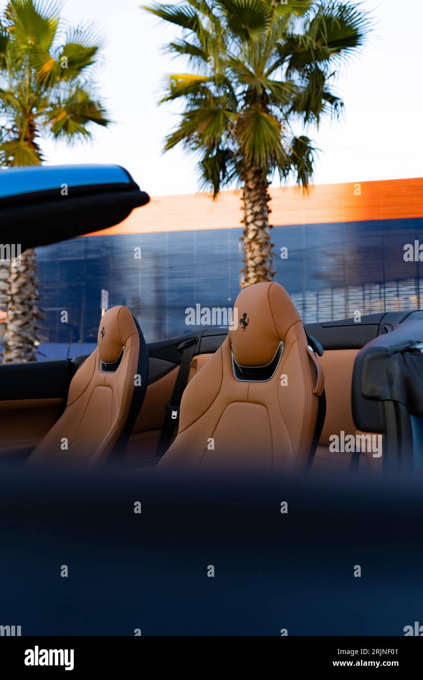 A car interior with its seats on the dashboard in an outdoor setting ...