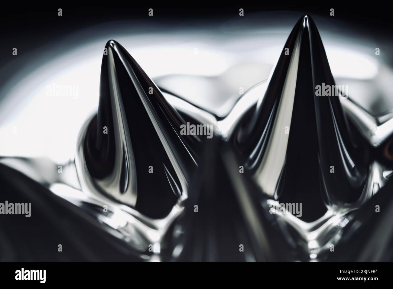 A macro close-up of ferrofluid reacting to a strong magnetic field ...