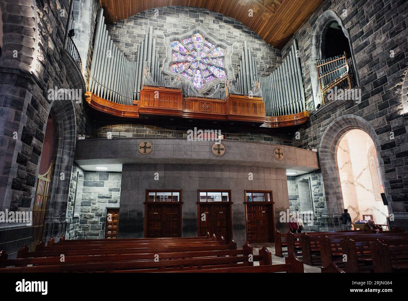 A stunning church interior, full of wooden pews and a magnificent ...