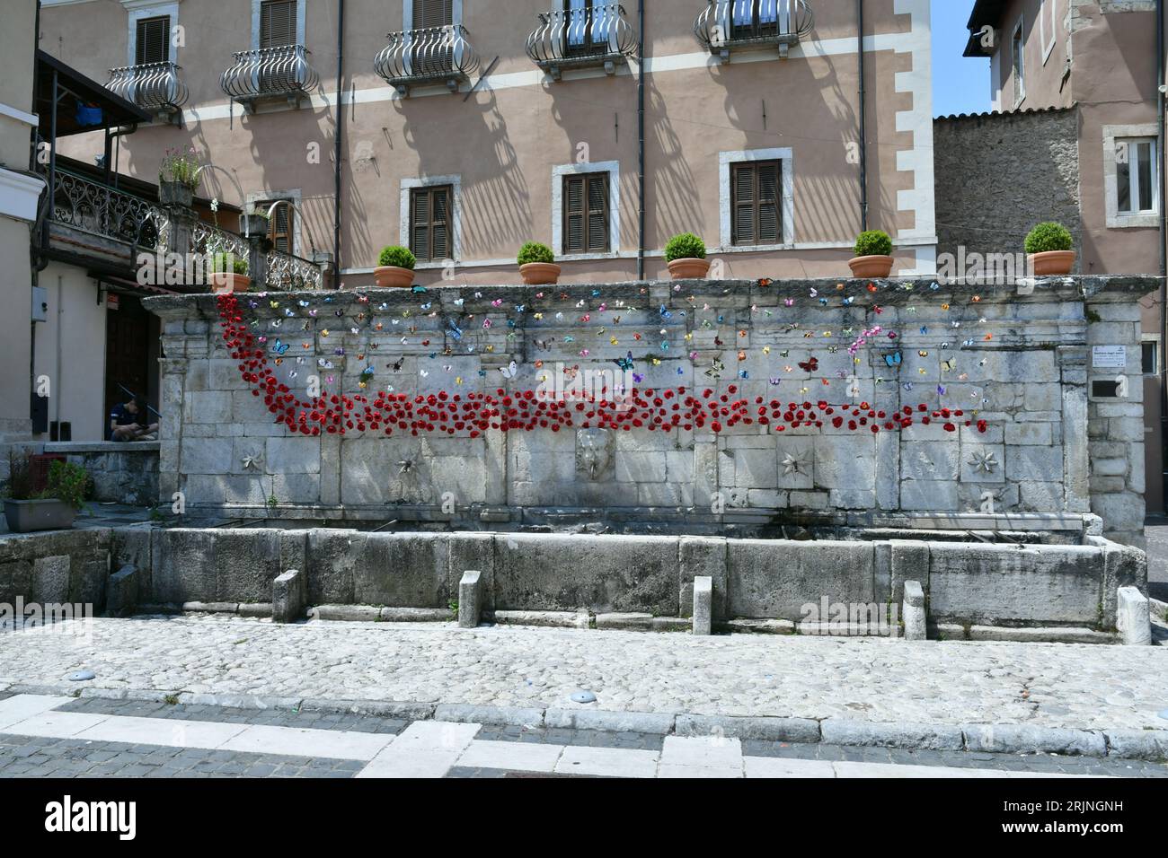 An ancient fountain in a medieval town in the Abruzzo region Stock ...