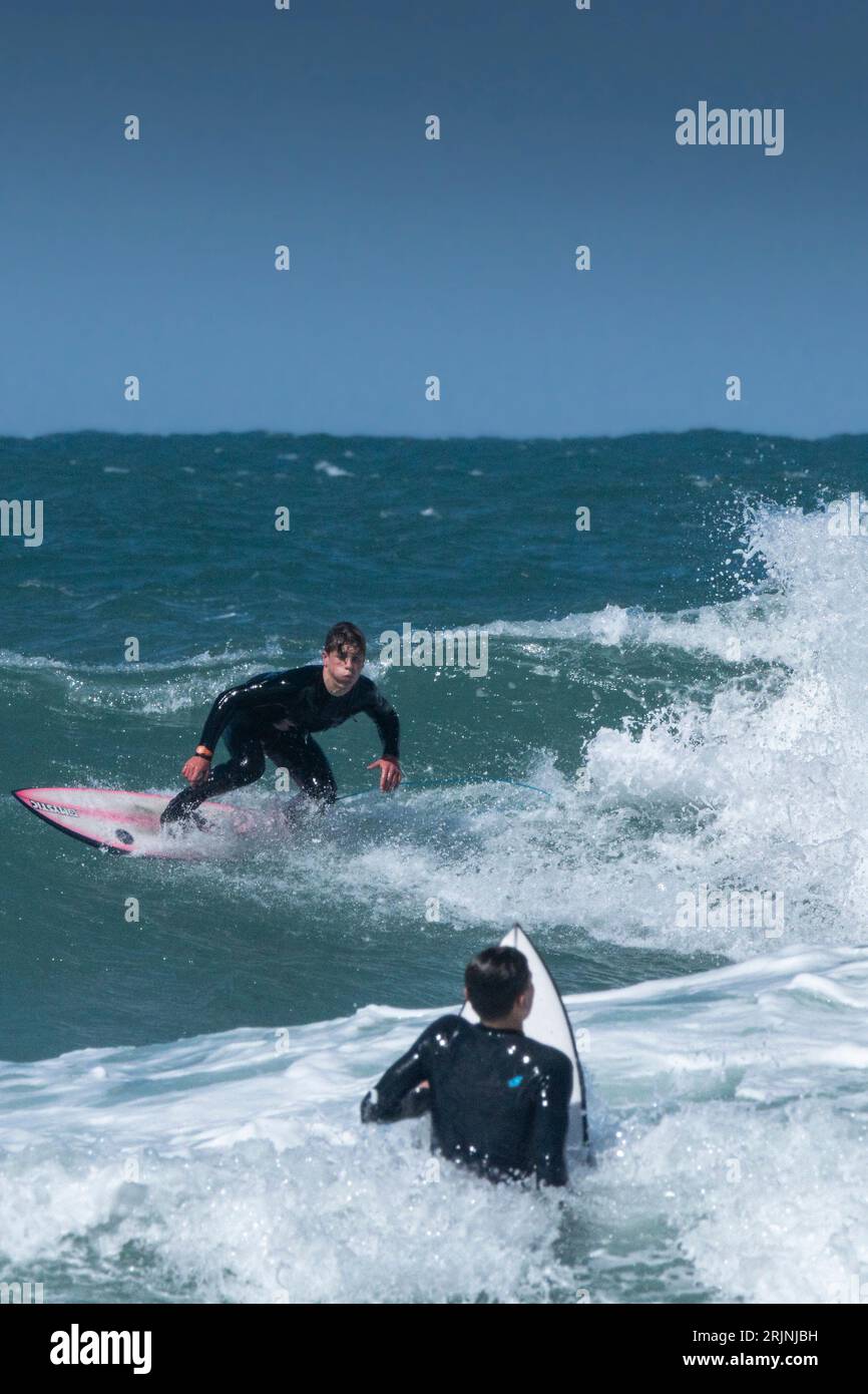 Surfers at Fistral in Newquay in Cornwall in the UK Stock Photo - Alamy