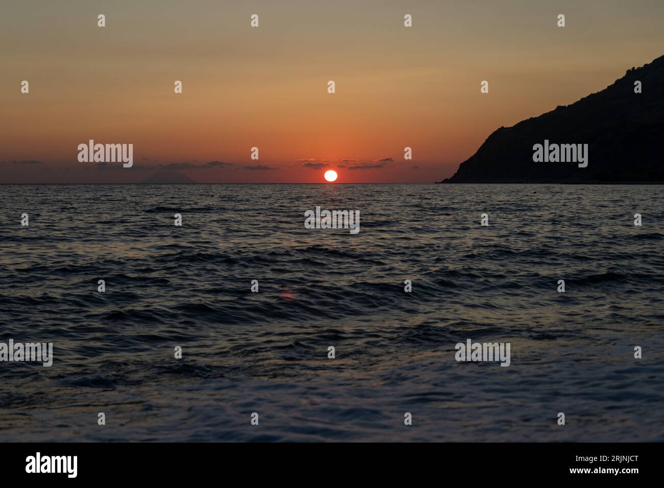 a sunset on the beach in town in italy Stock Photo - Alamy