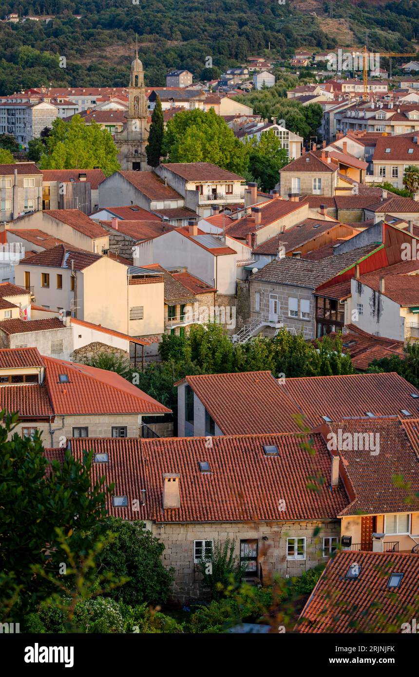 An idyllic small town is presented in the image, featuring a variety of ...