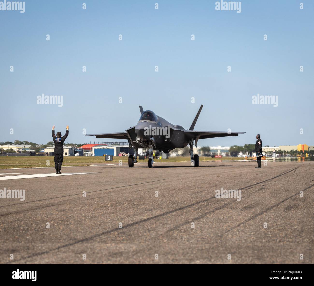The members of the US Air Force F-35 Demonstration Team assisting a ...