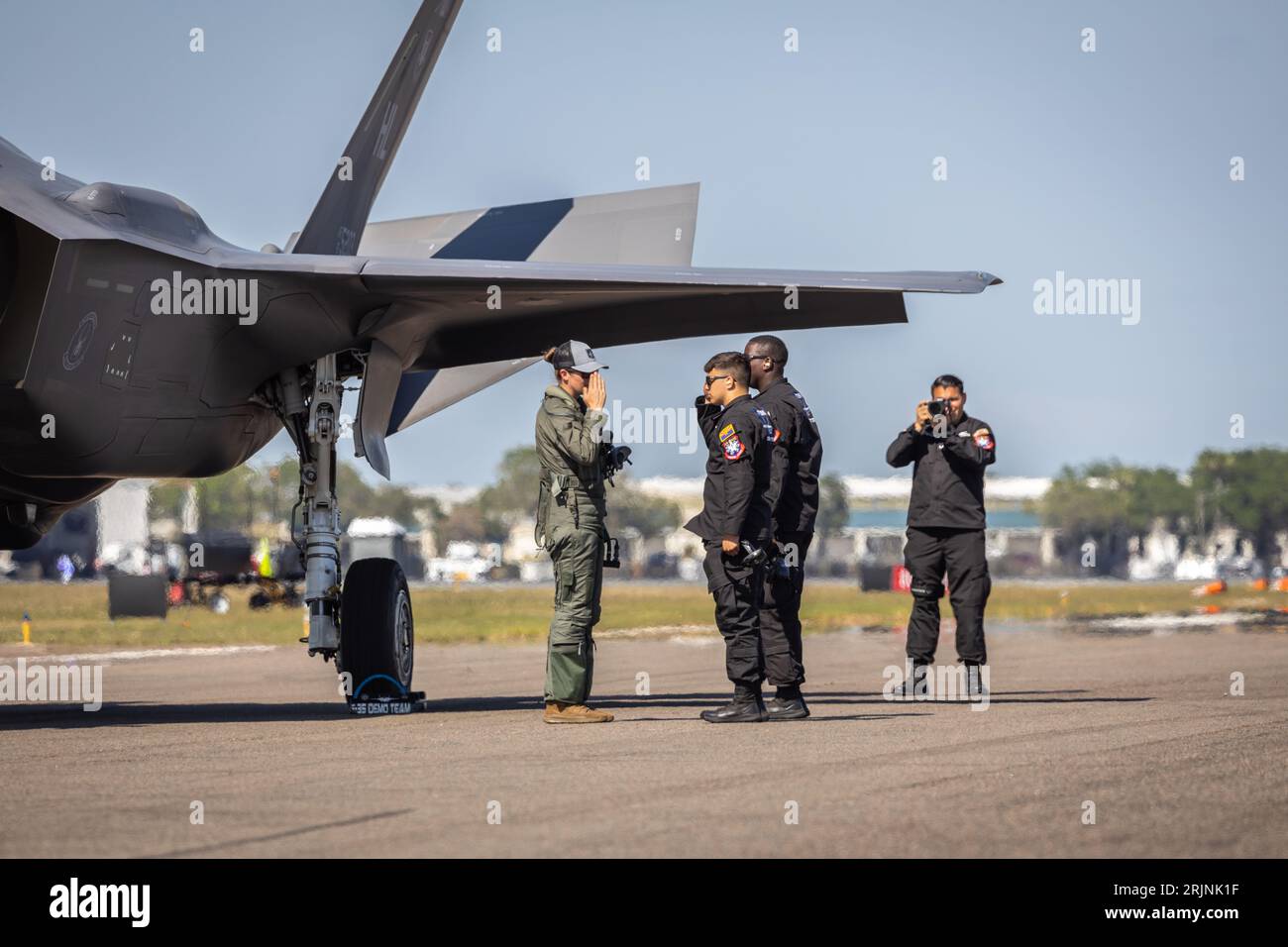 The members of the US Air Force F-35 Demonstration Team assisting a ...