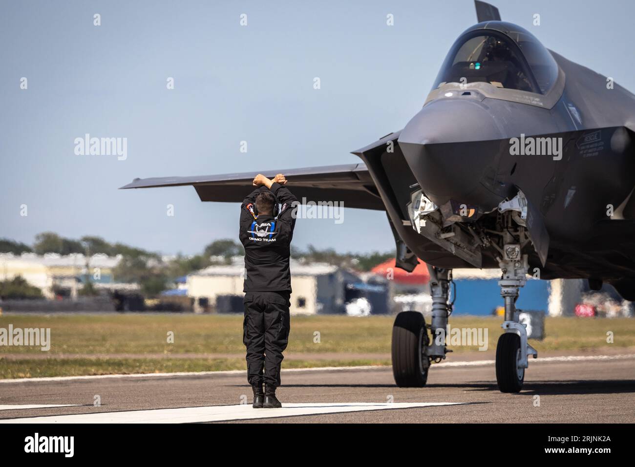 The members of the US Air Force F-35 Demonstration Team assisting a ...