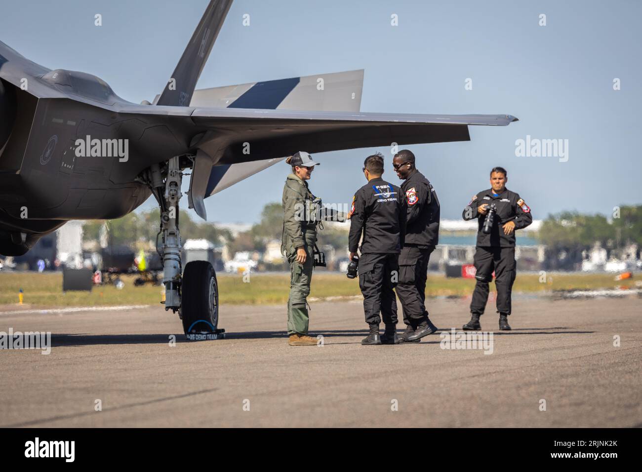 The members of the US Air Force F-35 Demonstration Team assisting a ...