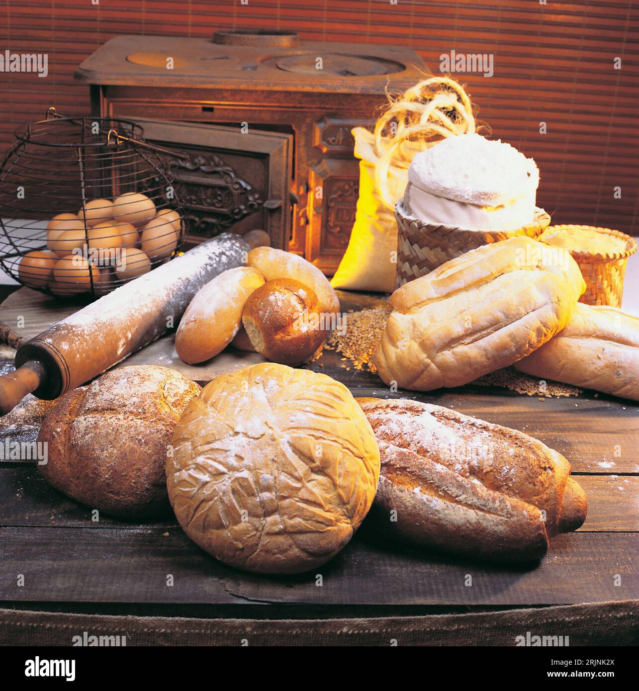 The different types of breads on a wooden table Stock Photo - Alamy
