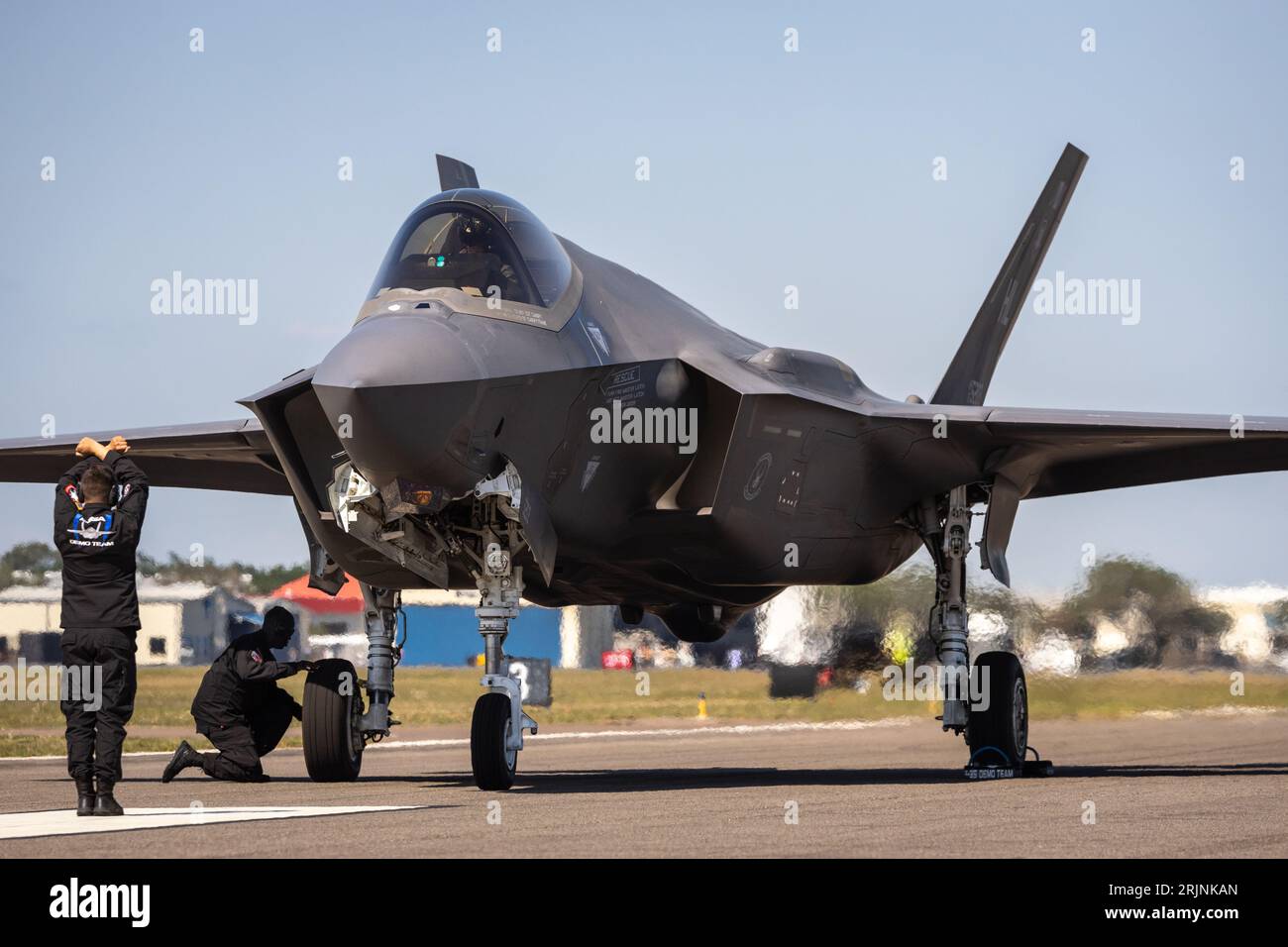 The members of the US Air Force F-35 Demonstration Team assisting a ...