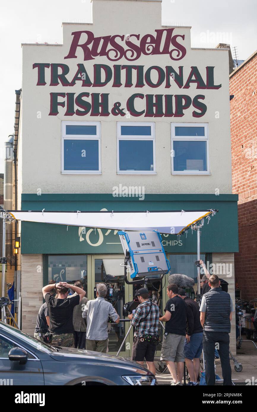 Redcar,UK. 23rd August 2023.Filming taking place at a fish shop on the sea front of Police drama ...