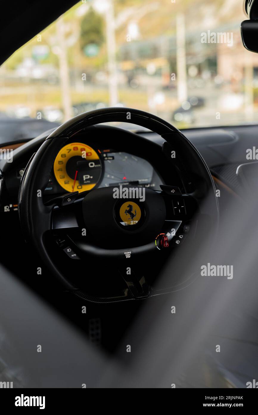 A close-up of the steering wheel and dashboard of a Ferrari Stock Photo ...
