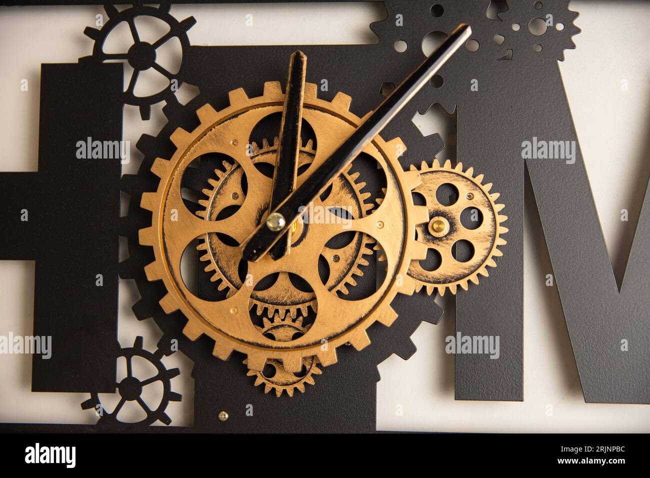 This image features a wooden wall clock with the word Home inscribed on ...