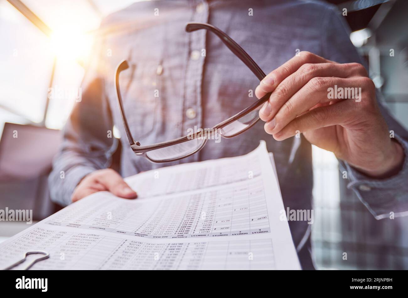 businessman reviewing document reports at office workplace Stock Photo ...