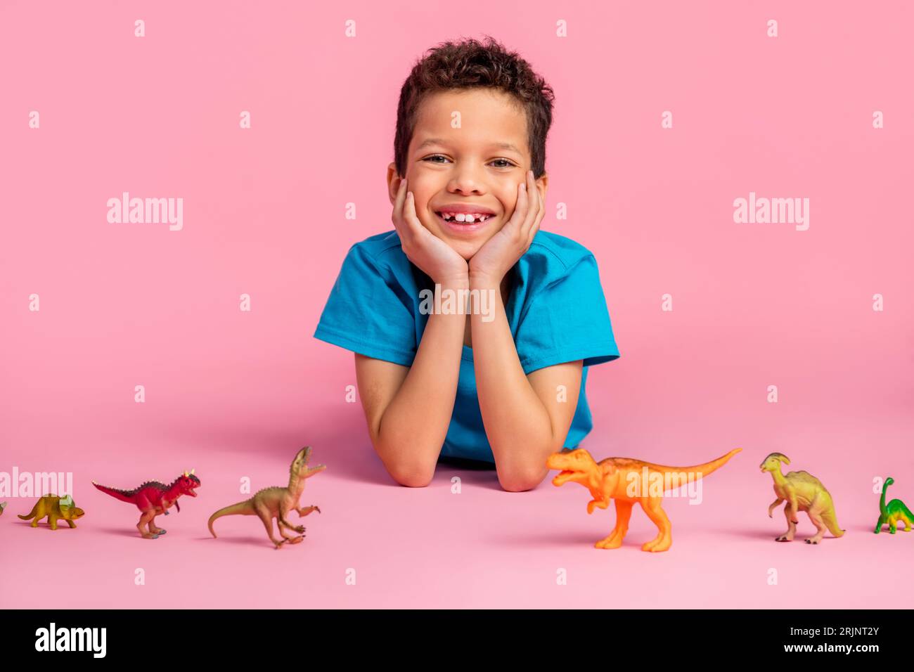 Photo of cheerful sweet little boy dressed blue t-shirt playing plastic ...