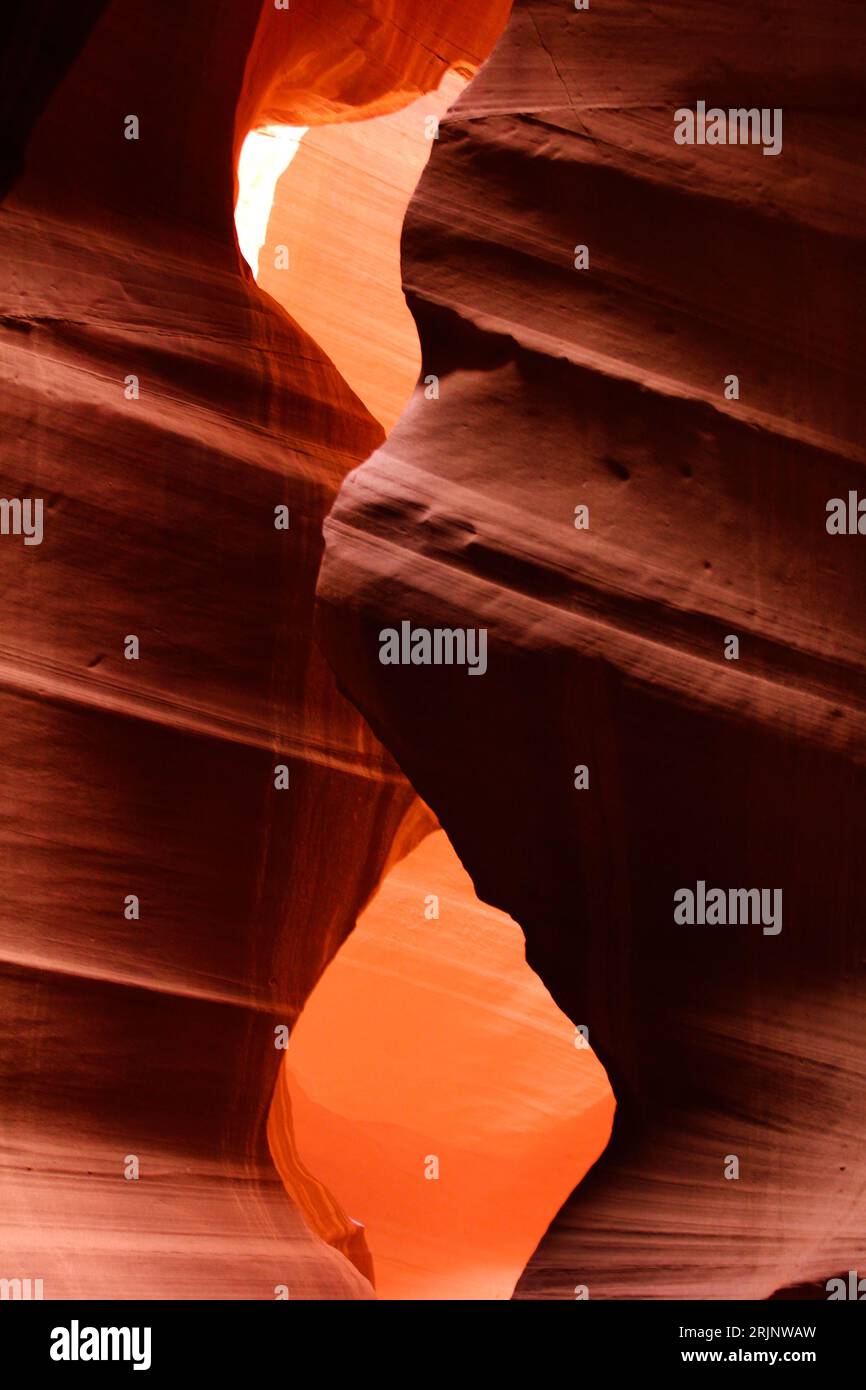 A breathtaking aerial view of a large canyon with sun-illuminated rocky ...