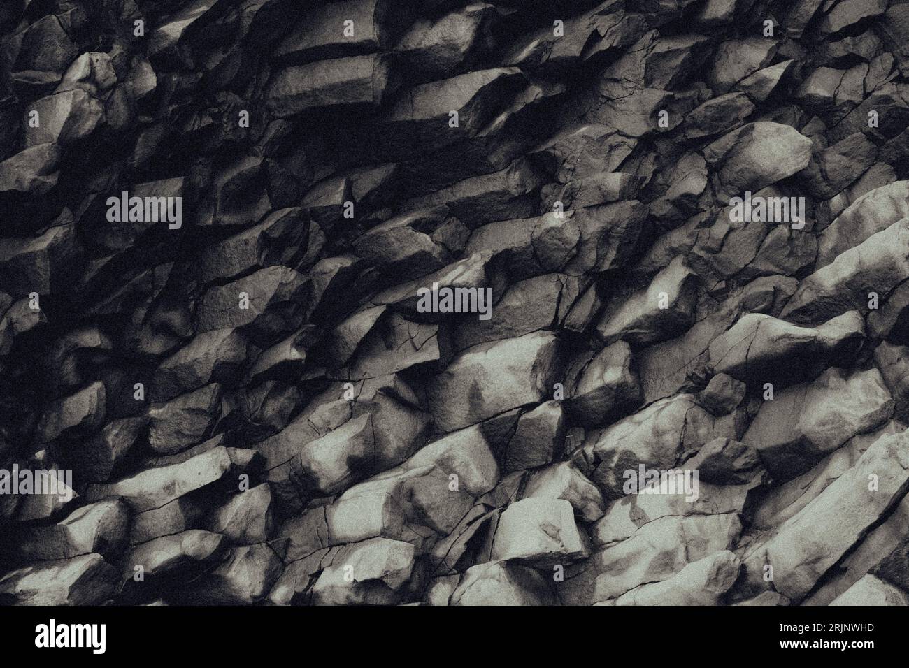 A high-resolution closeup shot of a distressed stone wall with natural ...