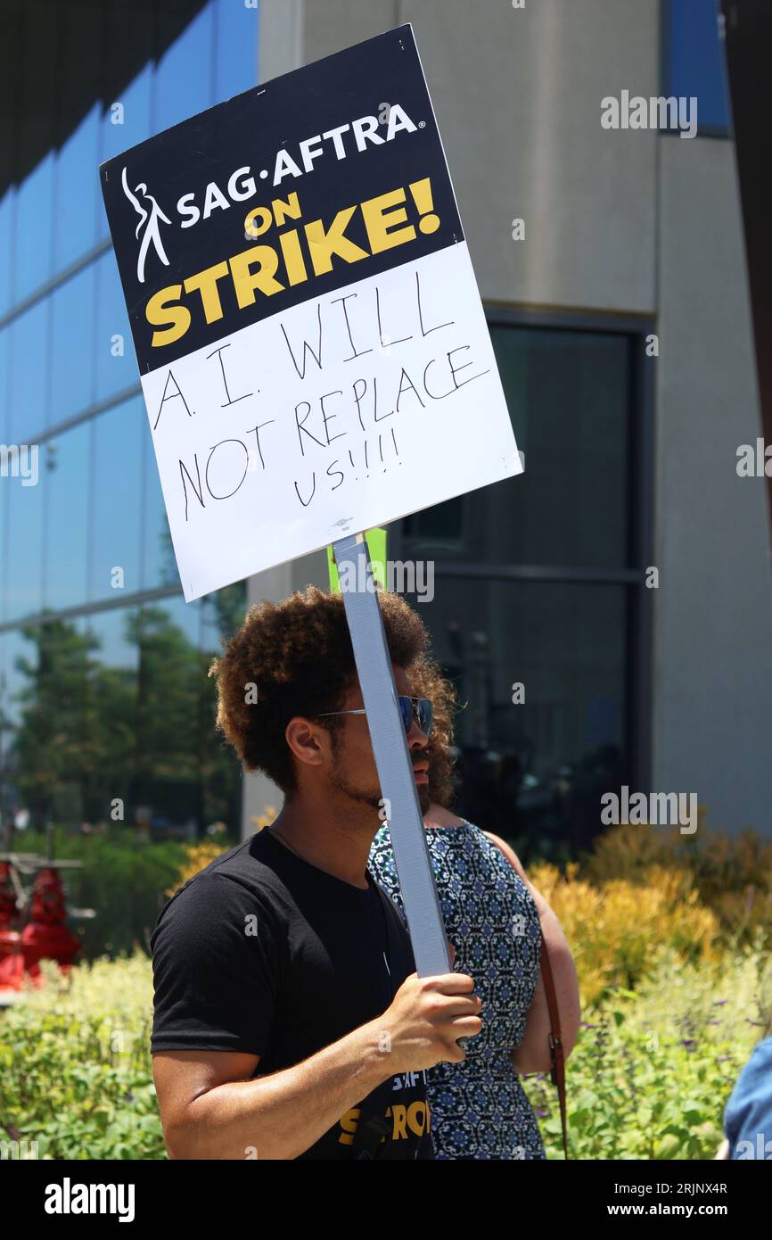 The AFTRA union members start day one of their strike, and march on the ...