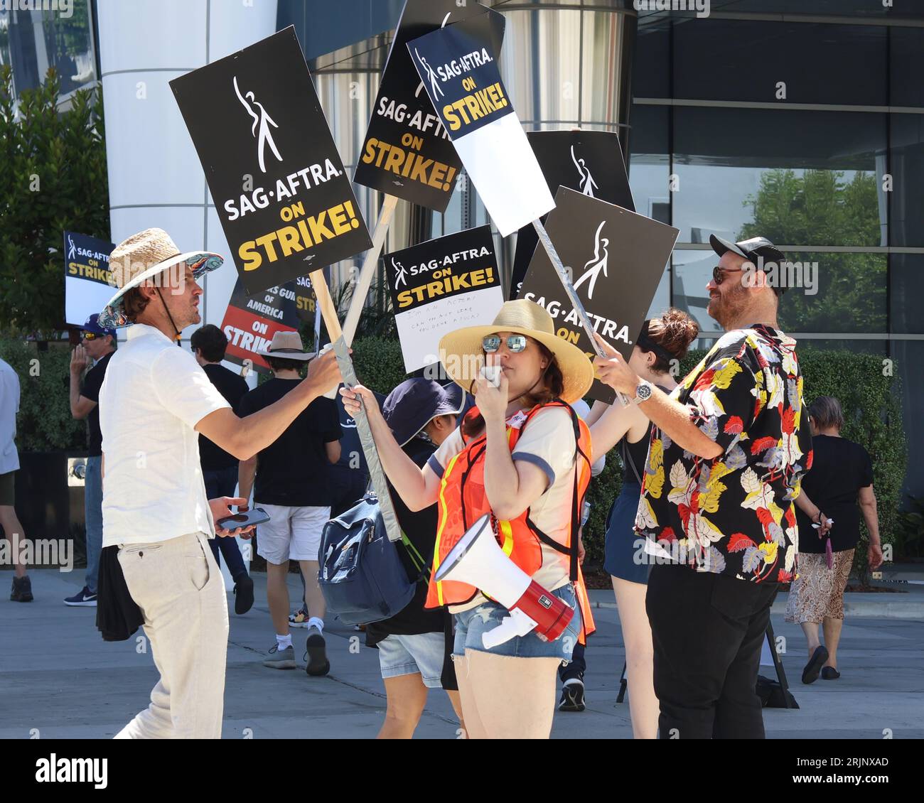 The AFTRA union members start day one of their strike, and march on the ...